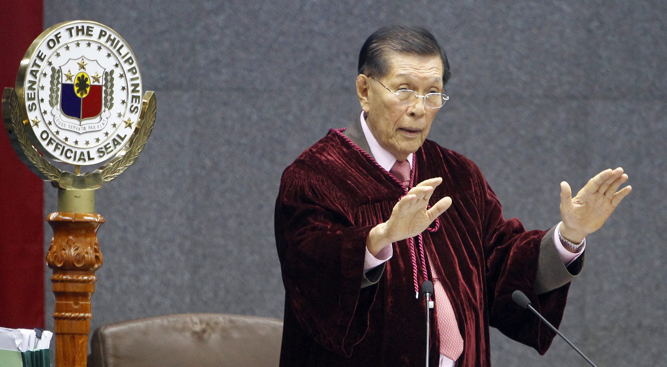 Senate President Juan Ponce Enrile gestures during the impeachment ...